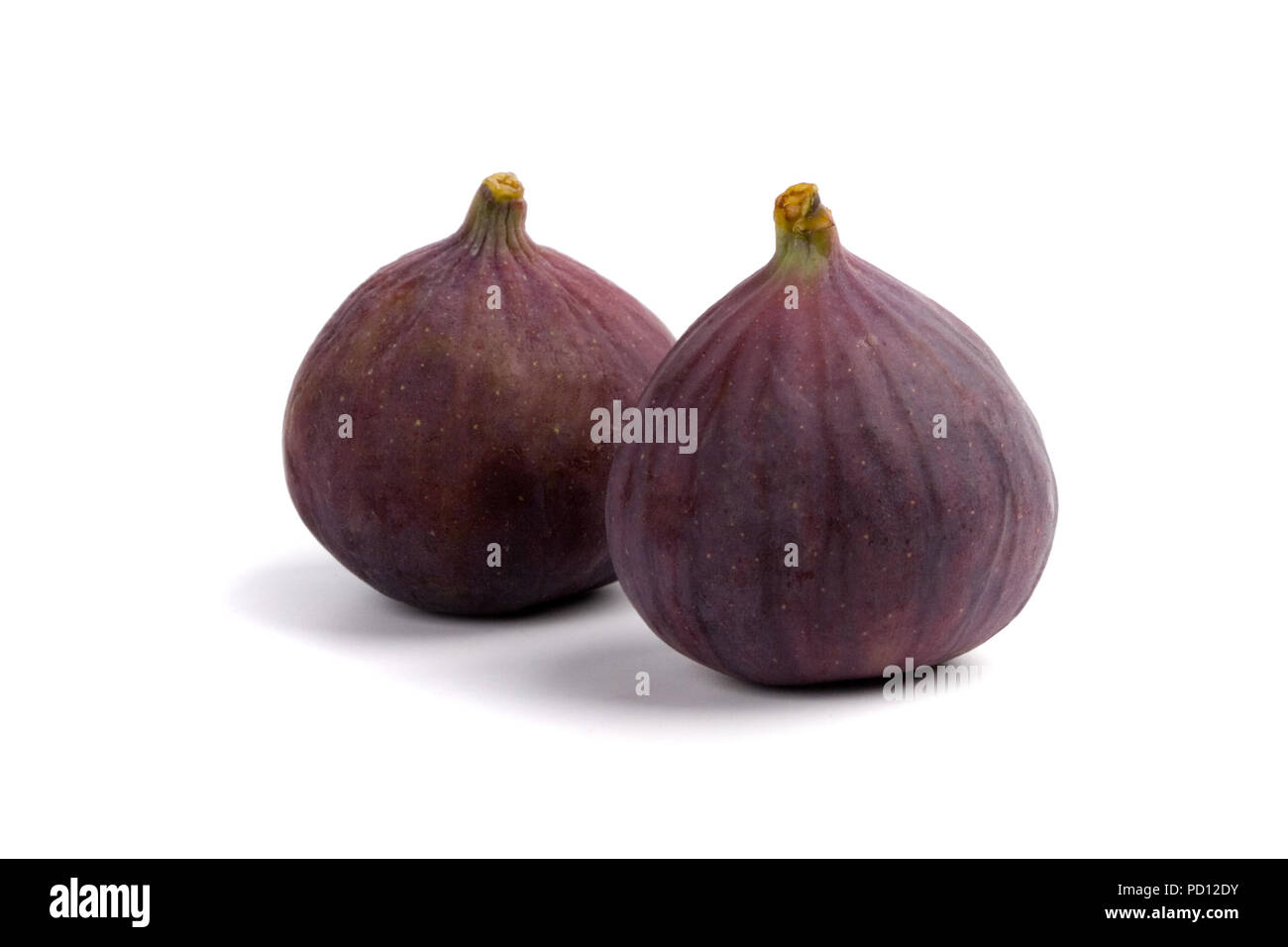 two fresh figs isolated on white background Stock Photo - Alamy