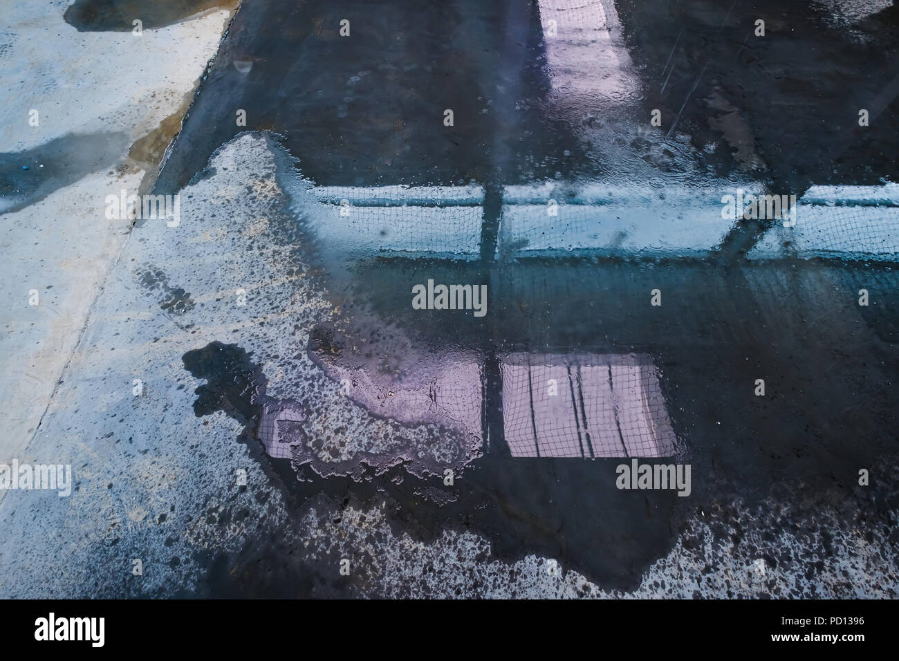 Construction site - flooded floor indoors with reflection of roof ...