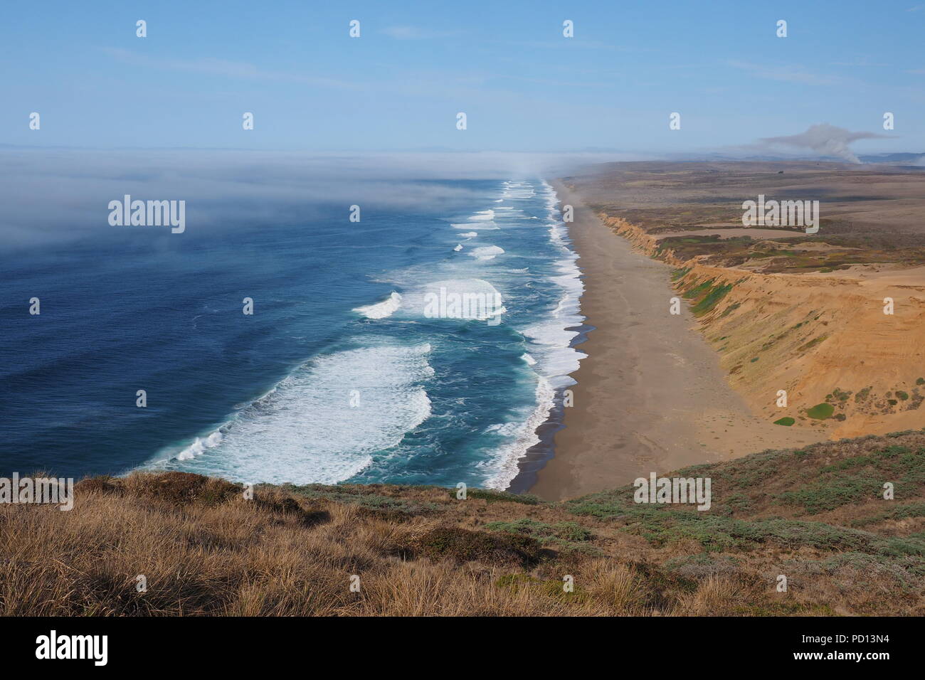 Looking down at the waves breaking onto the beach at Point Reyes ...
