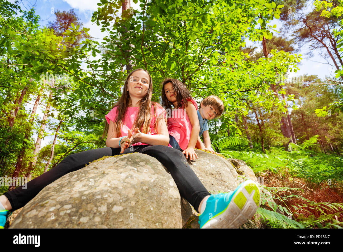 Group of children on the rocks hi-res stock photography and images - Alamy