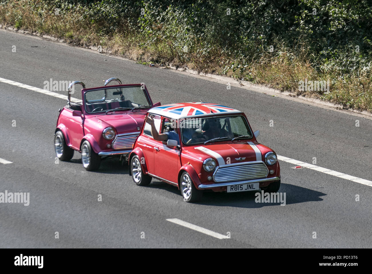 1997 90s red white restored old-type Rover Mini Cooper, towing a BMC ...