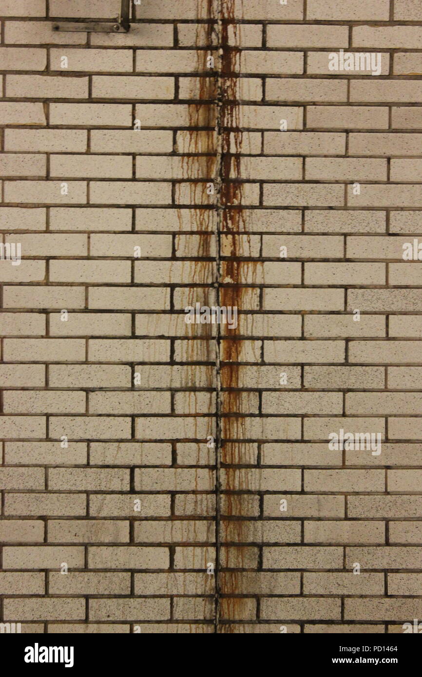 Rusty stains dripping along the subway file wall at the CTA Blue Line ...
