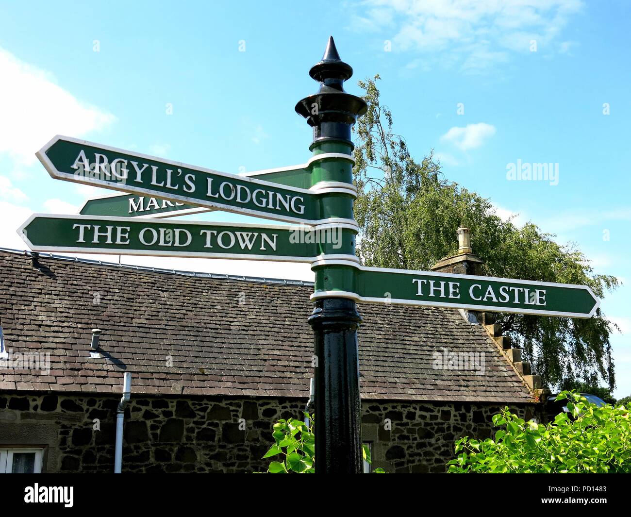 Sign pointing to different directions near Stirling castle, Scotland ...