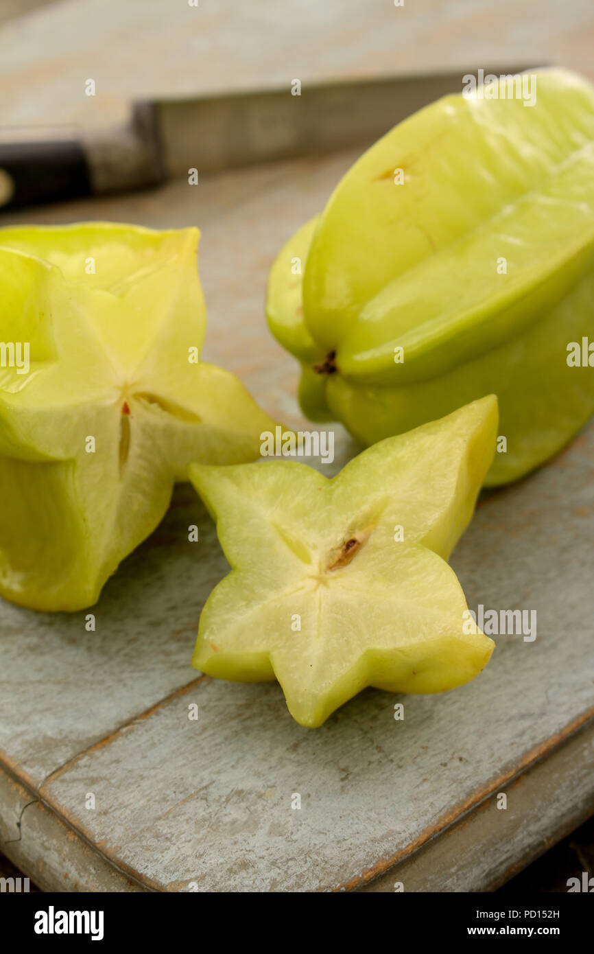 Cutting exotic starfruit averrhoa carambola hi-res stock photography ...