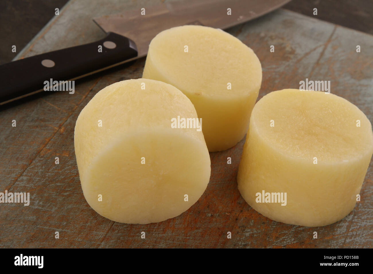 barrel cut fondant potatoes Stock Photo - Alamy