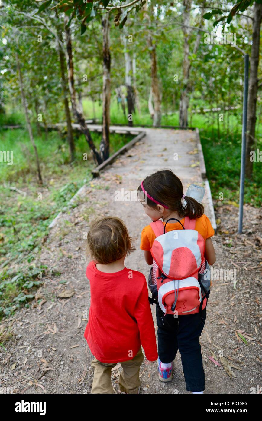 Two school age girls walking along a path, Booroona walking trail on ...