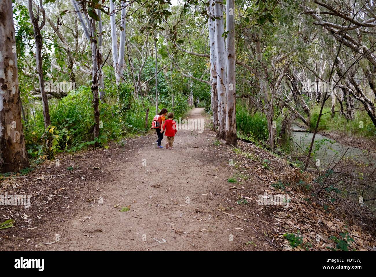 Two school age girls walking along a path, Booroona walking trail on ...