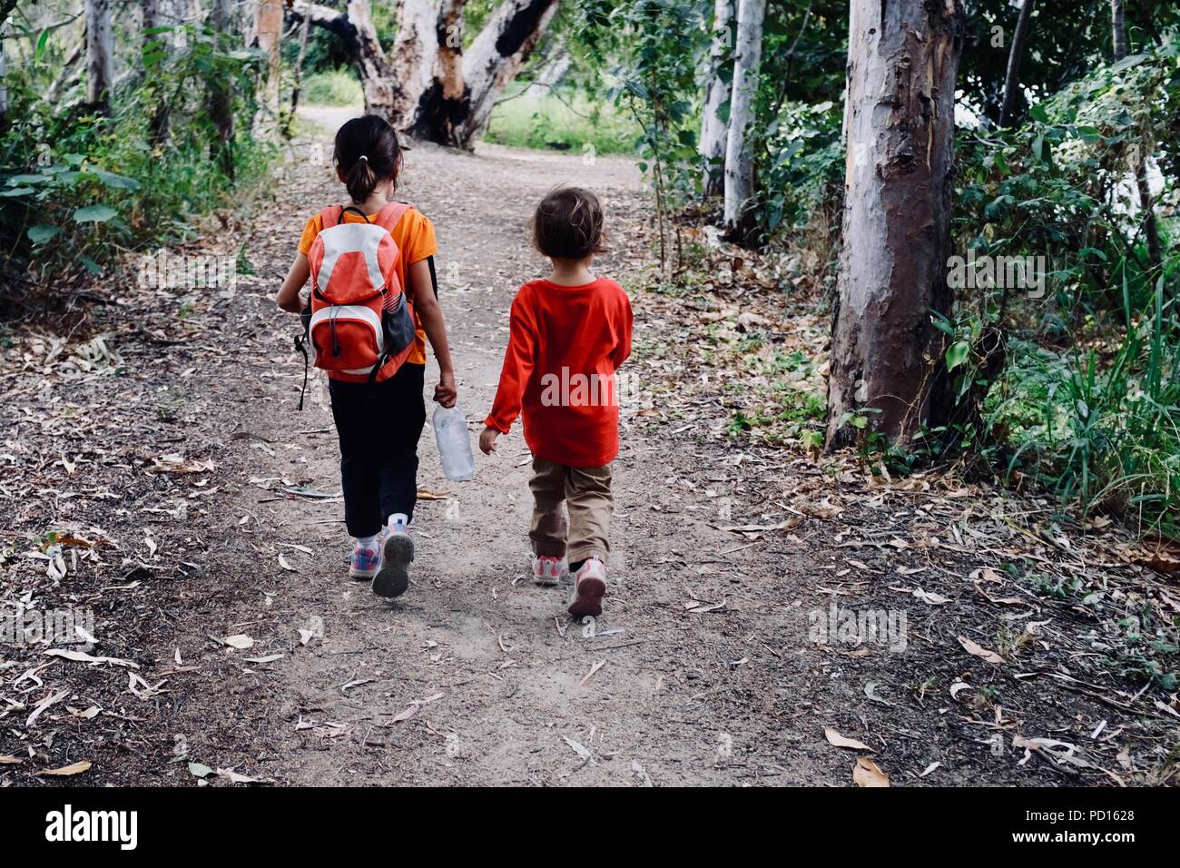 Two school age girls walking along a path, Booroona walking trail on ...