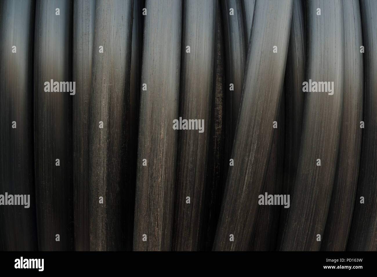 black pipe hose roll background and texture Stock Photo - Alamy