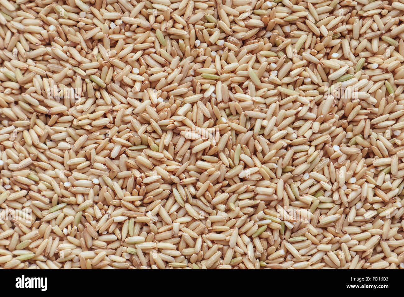 Raw brown rice. top view food background texture Stock Photo - Alamy
