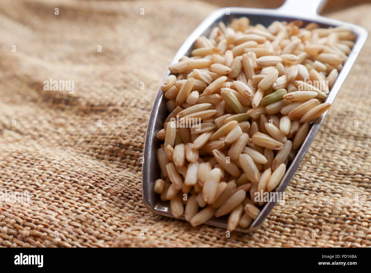 Raw brown rice in a spoon and bowl. top view food background Stock ...