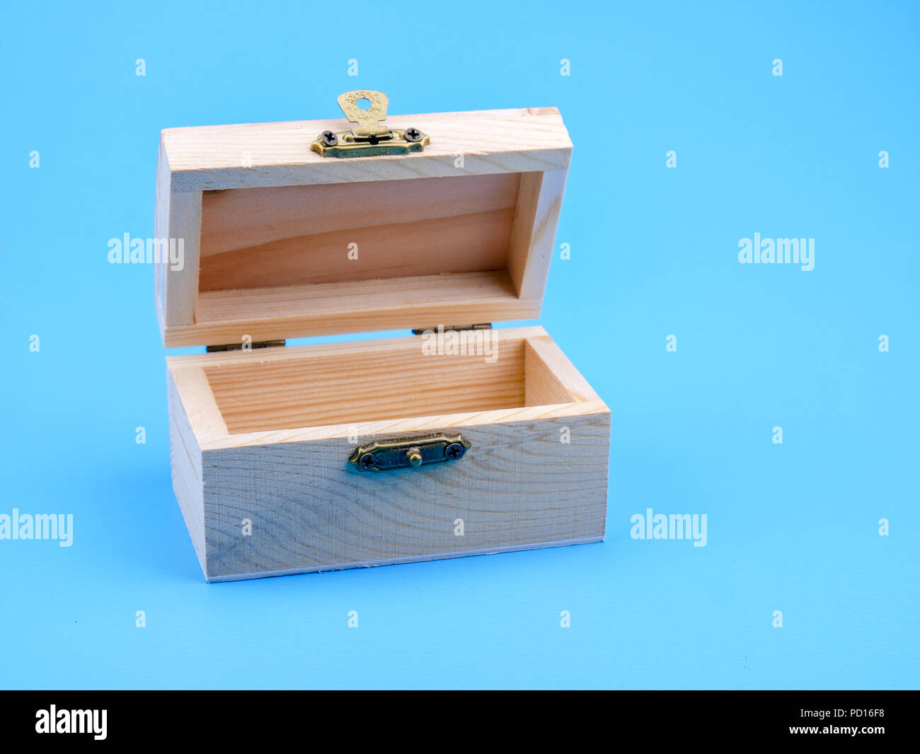 Empty wooden square box on blue background Stock Photo - Alamy