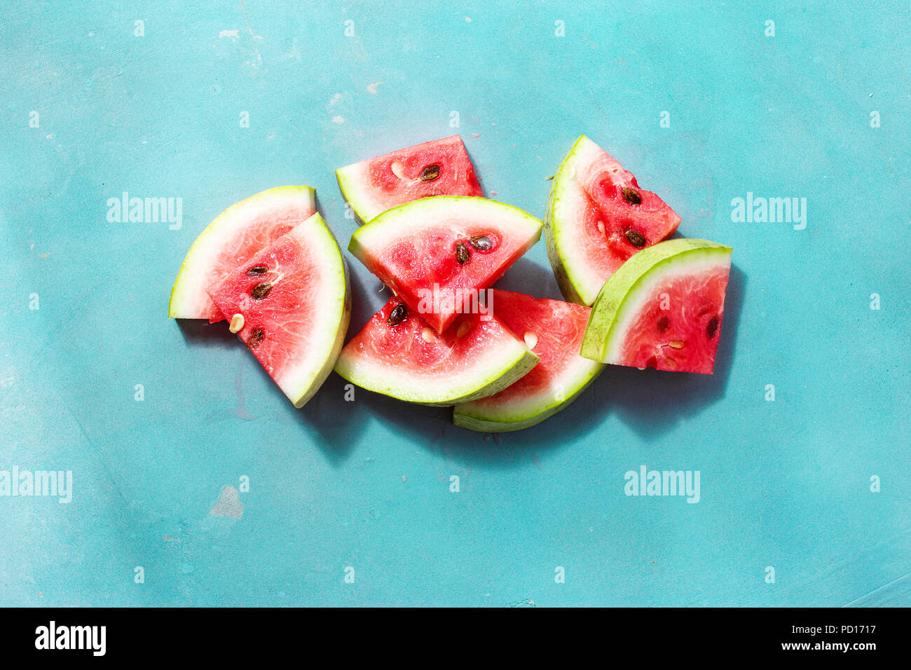 Flat lay watermelon slice on stone blue background top view Stock Photo ...