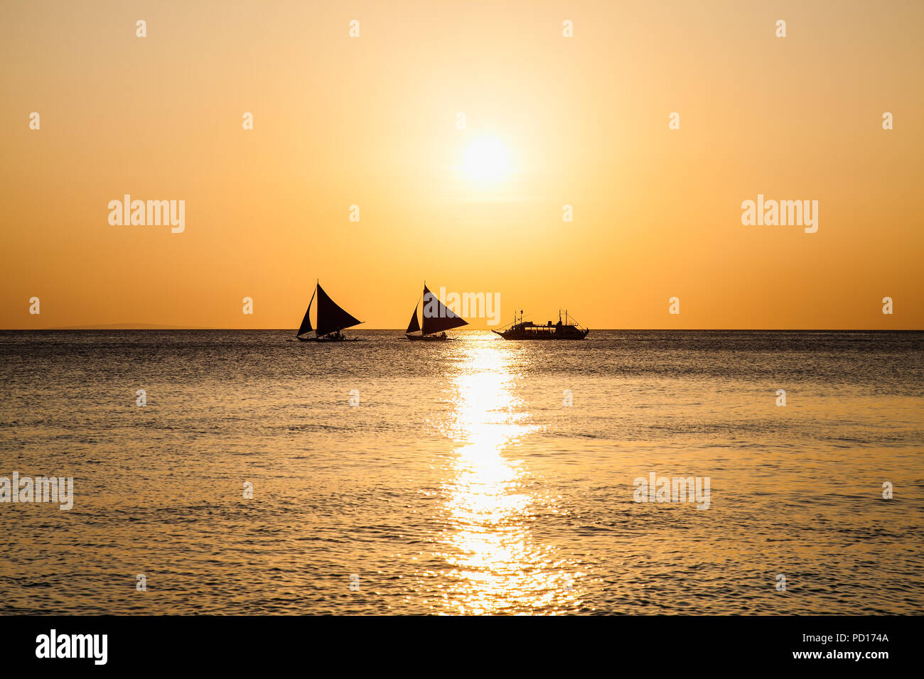 Philippine traditional boat sailing in sunset. Boracay Island ...