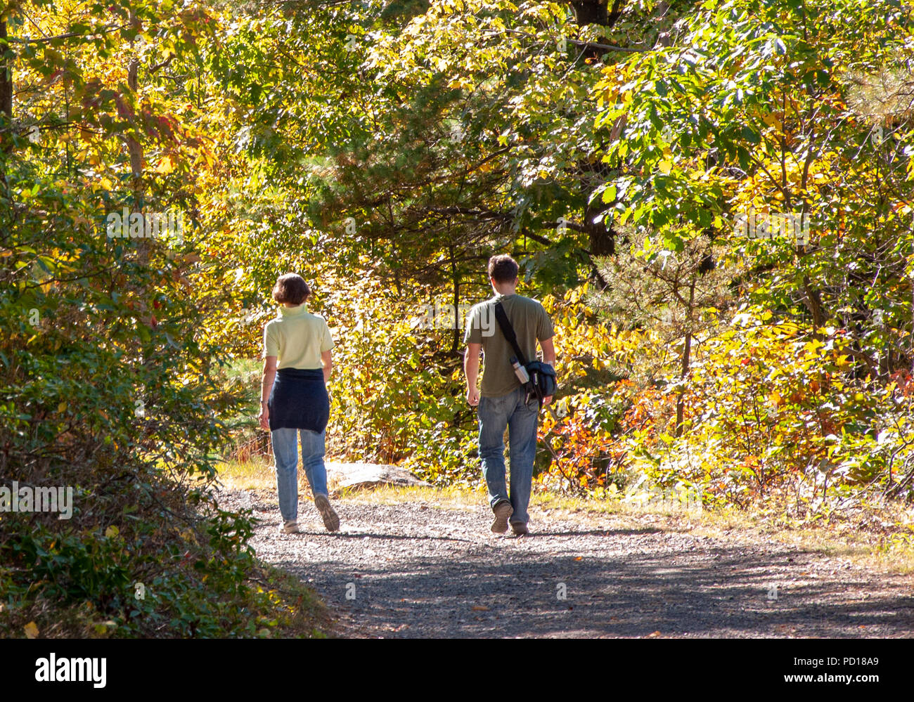 A couple walking on a trail in the country Stock Photo - Alamy