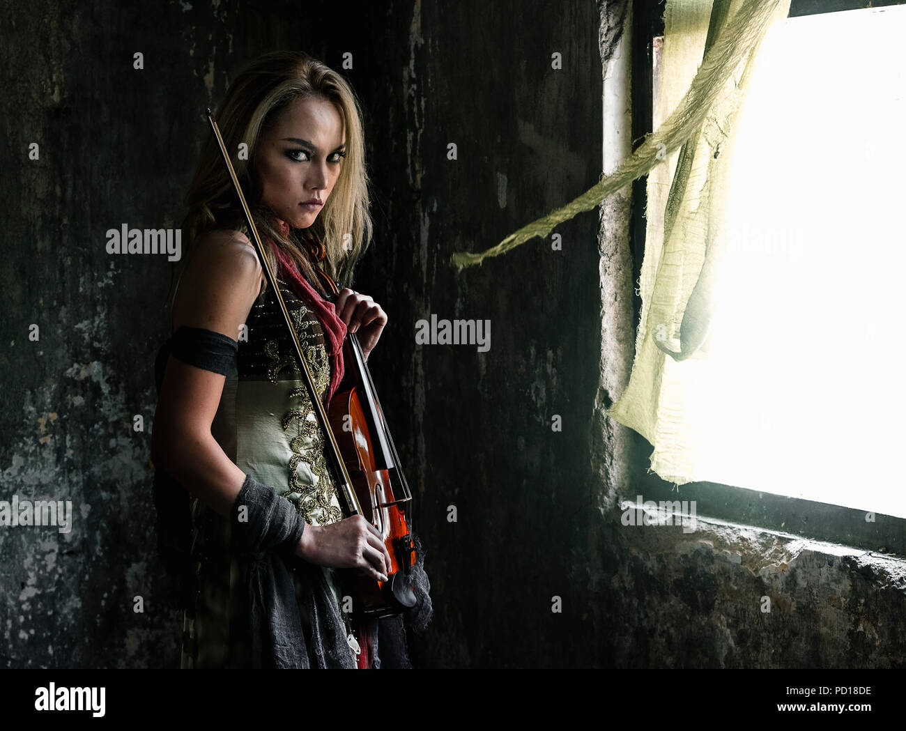 Dark moody Portrait of Violinist showing deep expression Stock Photo ...