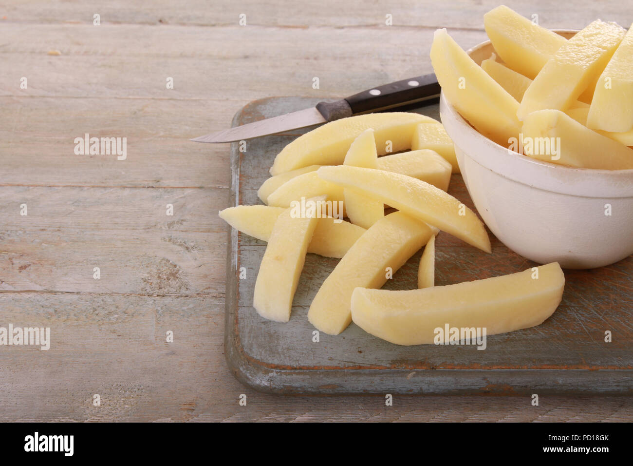 uncooked chipped potatoes Stock Photo - Alamy