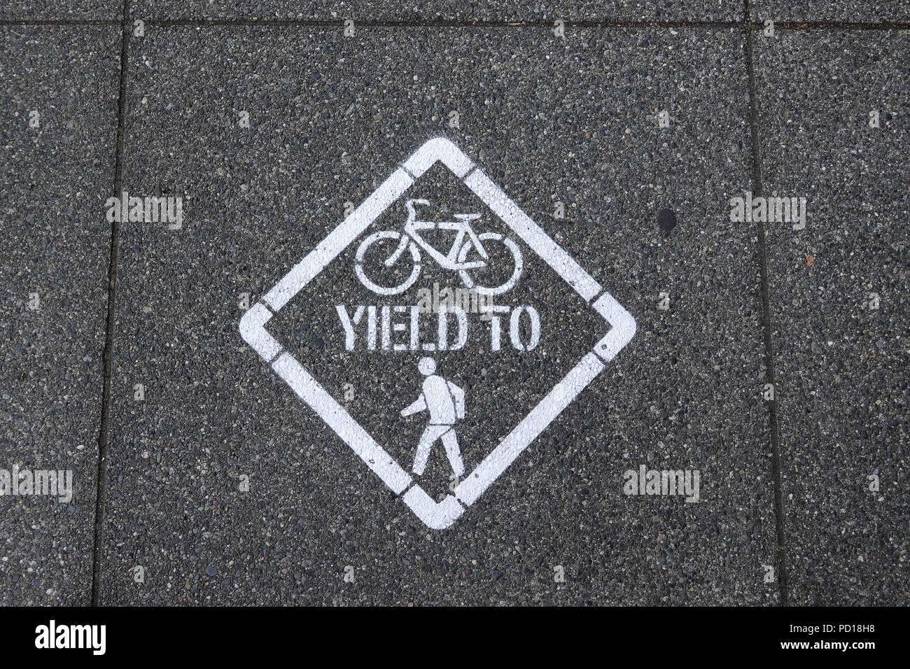 "Bike yield to pedestrian" road marking in Bellevue, WA, USA Stock ...