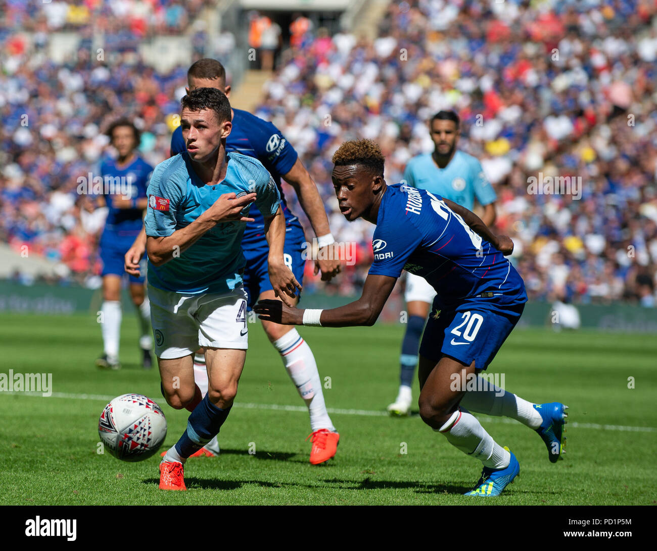 London, UK. 6th Aug, 2018. Phil Foden (L) of Manchester City competes ...