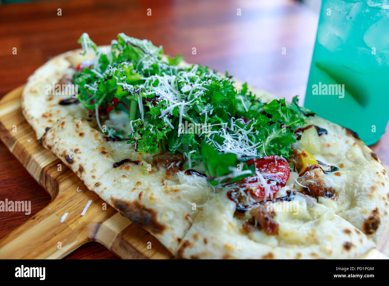 Italian pizza on wood table with ingredients Stock Photo - Alamy