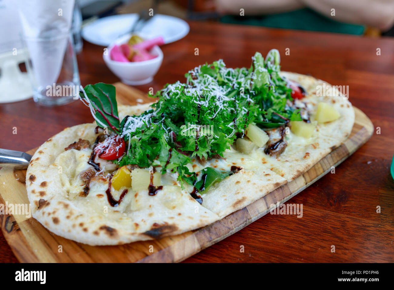 Italian pizza on wood table with ingredients Stock Photo - Alamy
