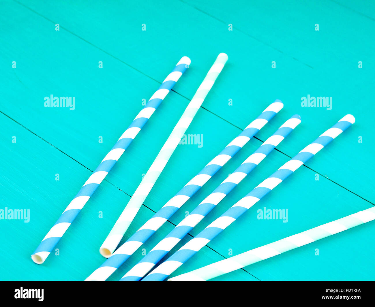 Cocktail with plastic straws and cocktail stick hi-res stock ...