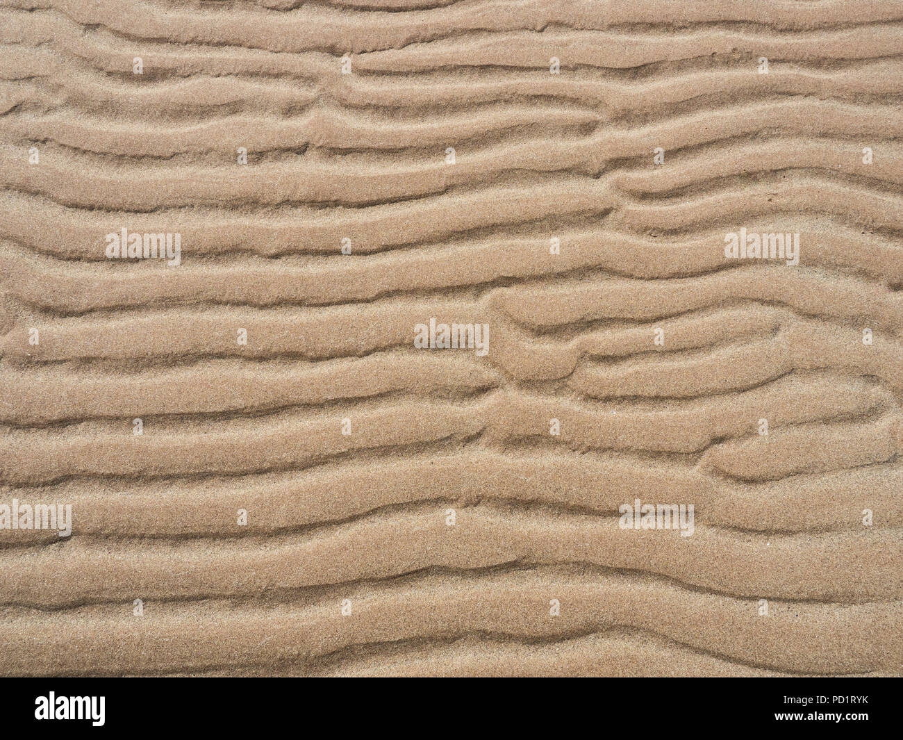 Wind formed sand pattern background Stock Photo - Alamy