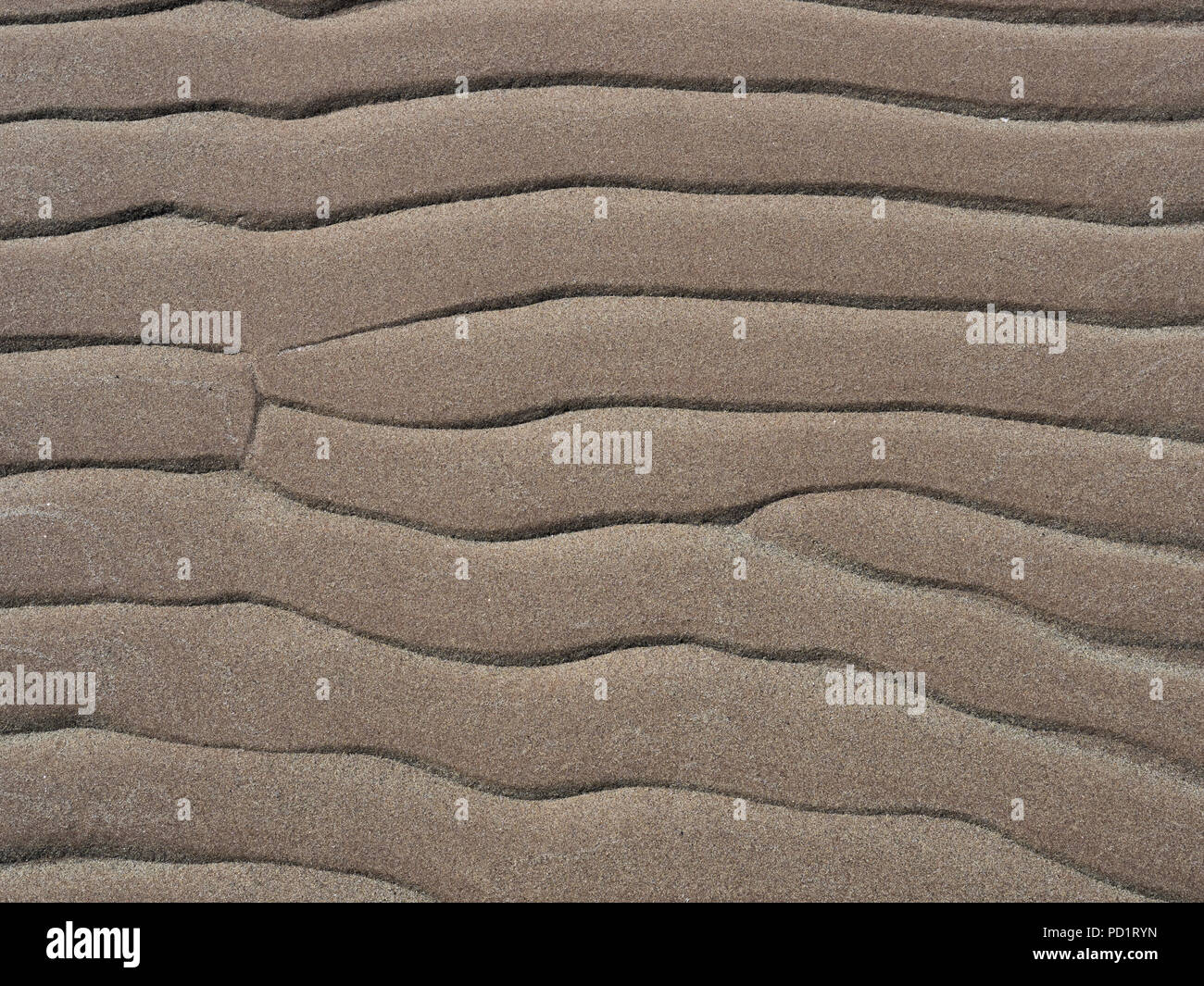 Wind formed sand pattern background Stock Photo - Alamy
