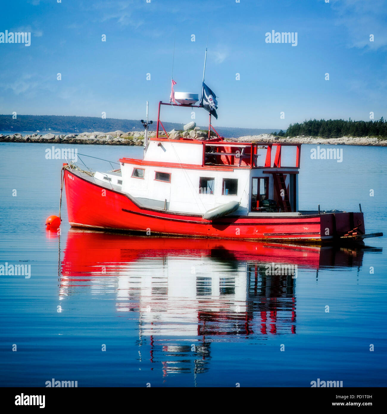 A fishing boat anchored on the Nova Scotia coastline Stock Photo - Alamy