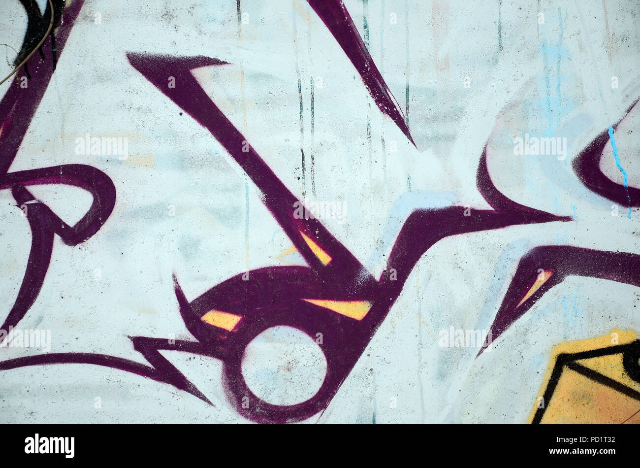 The old wall, painted in color graffiti drawing red aerosol paints ...