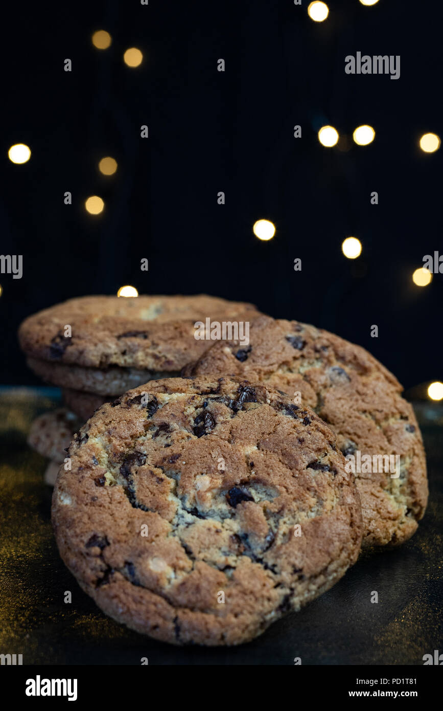 Cookies on dark background with fairy lights Stock Photo - Alamy