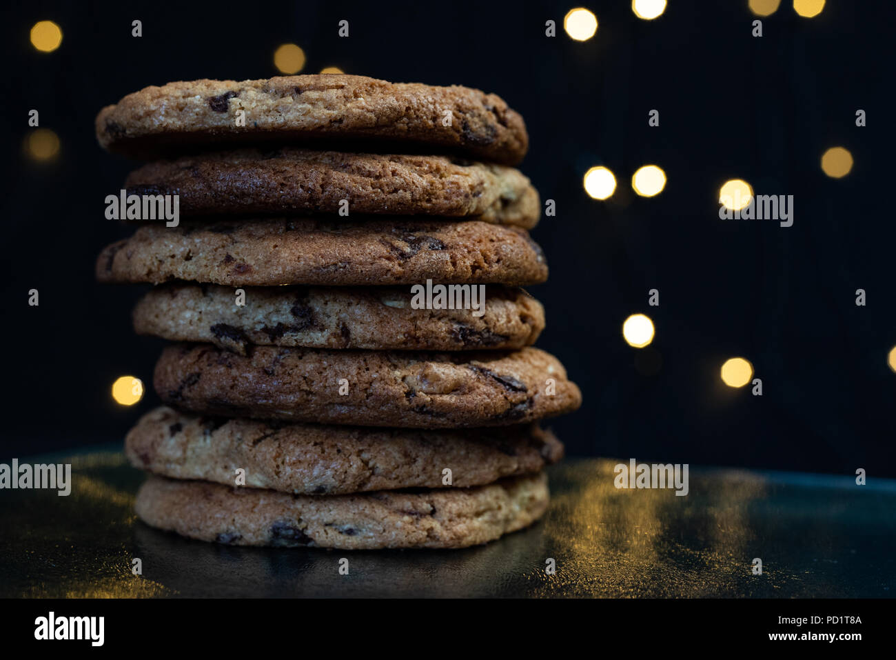 Cookies on dark background with fairy lights Stock Photo - Alamy