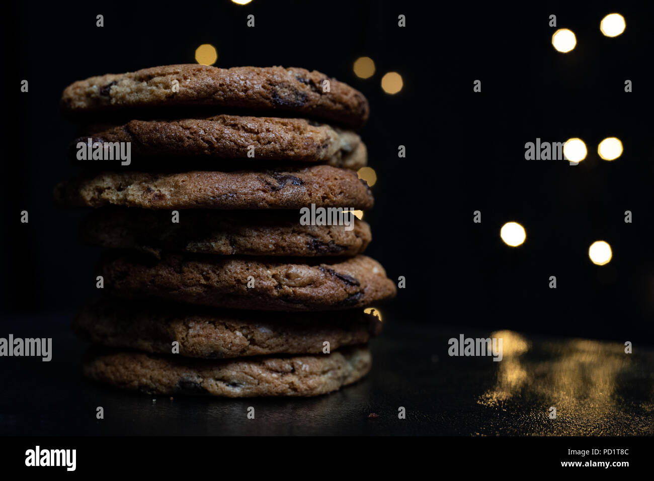 Cookies on dark background with fairy lights Stock Photo - Alamy