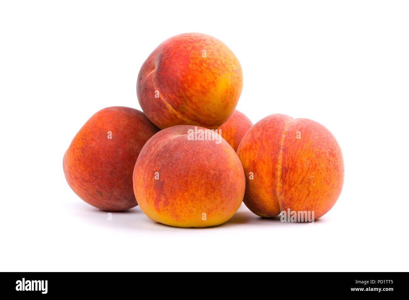 five peaches on white background Stock Photo - Alamy