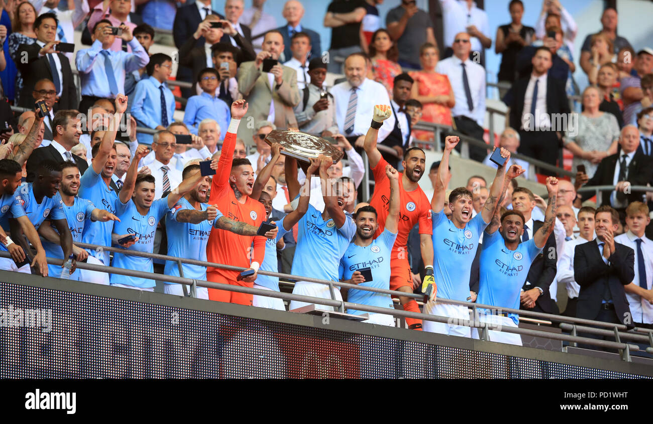 Manchester City players celebrate with the Community Shield after ...