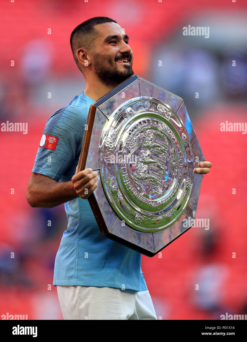 Manchester City's Ilkay Gundogan with the trophy after the Community ...