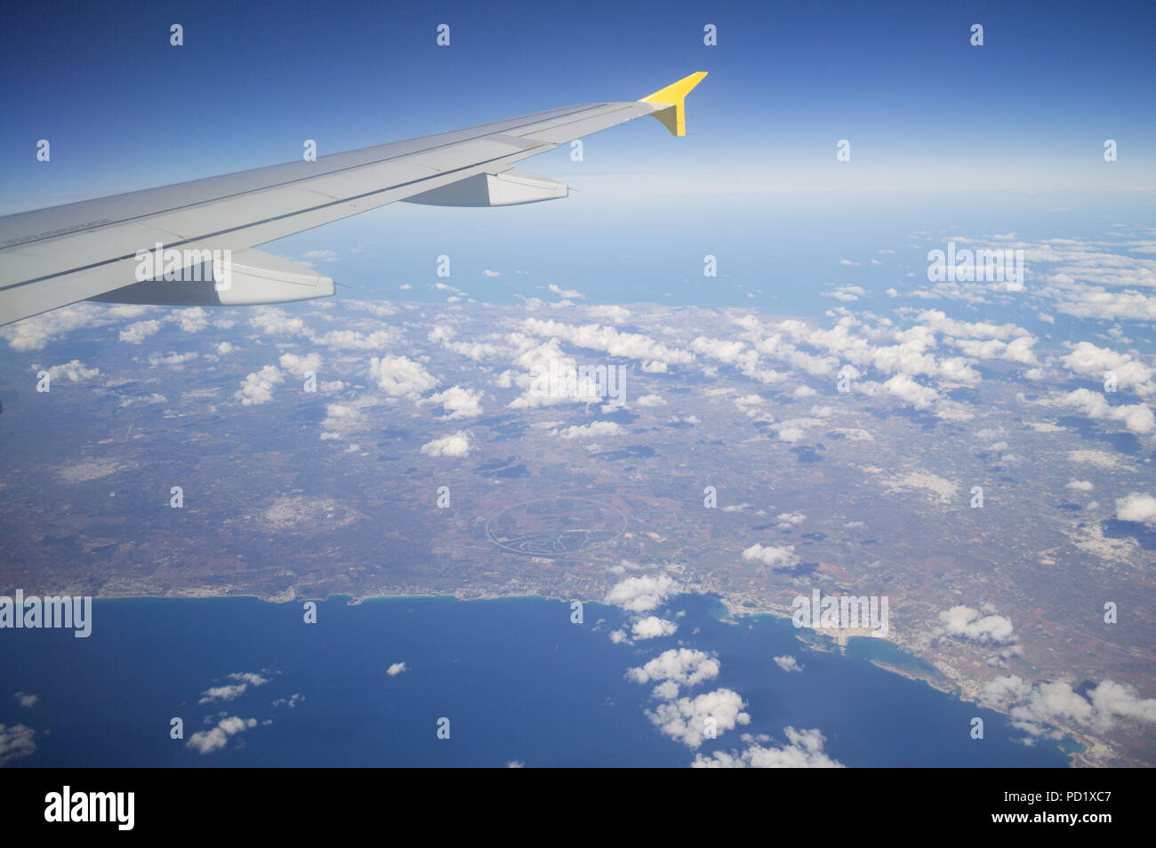 Aerial View of Italian Coastline with Wing of Plane in Flight Stock ...