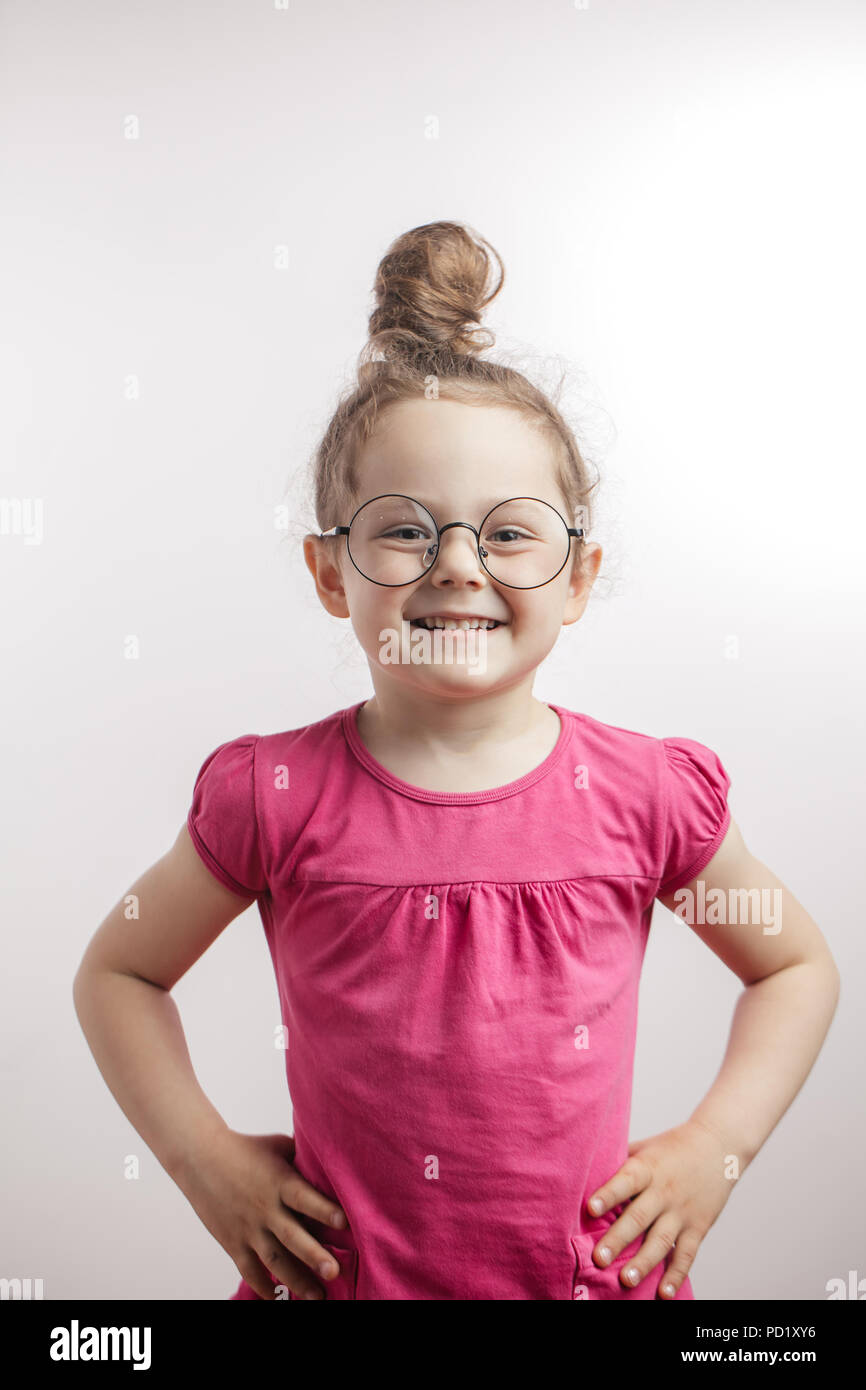 optimistic little girl wunderkindwith hands on the waiste. child ...