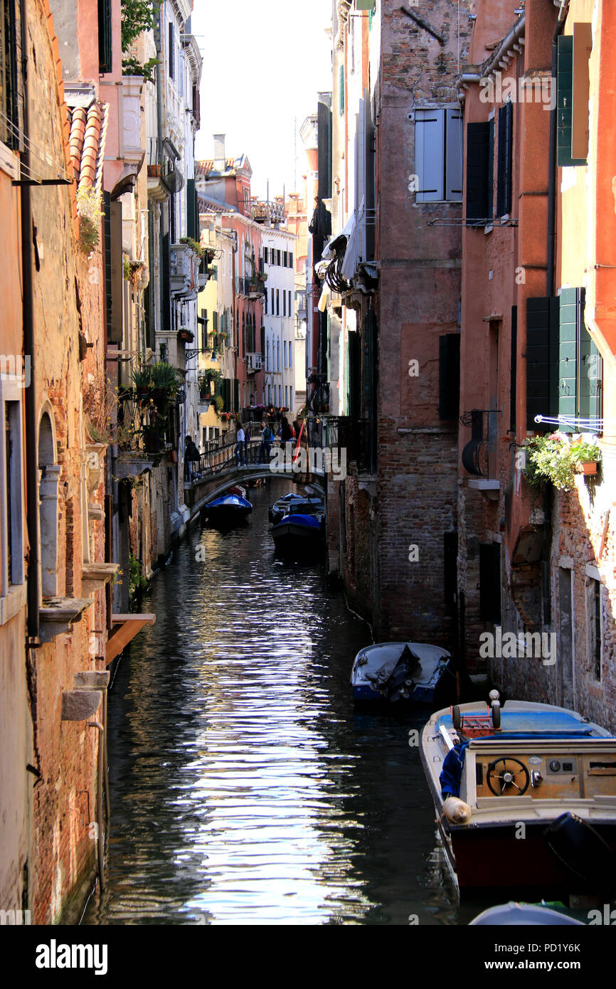 Boats moored to the embankment of a narrow canal in Venice, Italy Stock ...