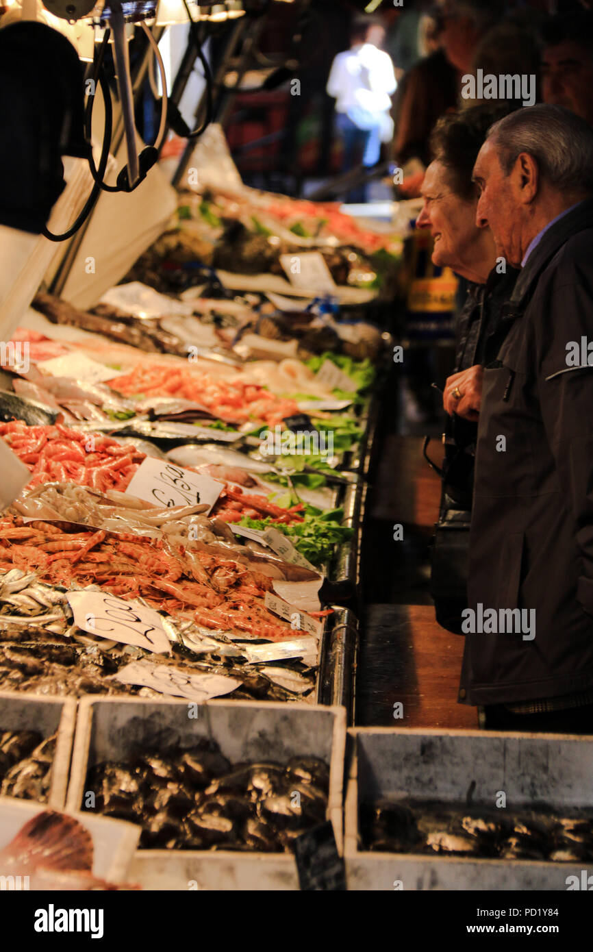 Old woman buying fish hi-res stock photography and images - Alamy