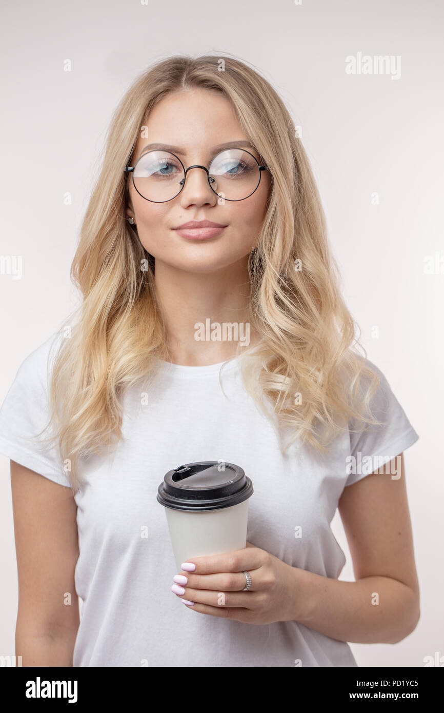 good looking model with coffee is looking at the camera Stock Photo - Alamy