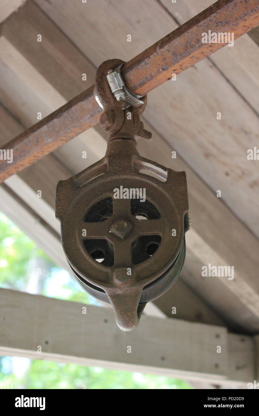 Log cabin homestead pulley to pull up water on a sunny summer day Stock ...
