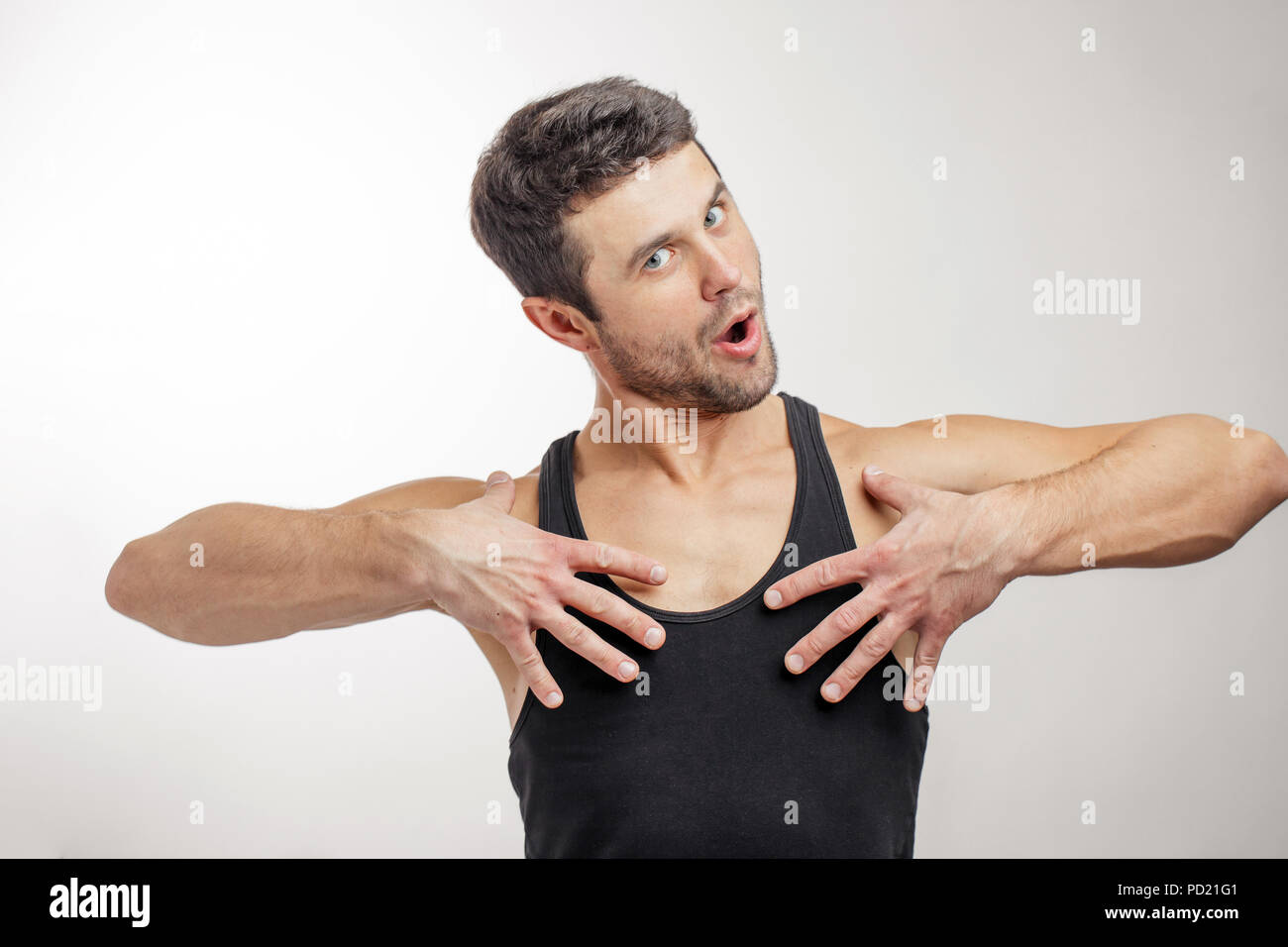 crazy man with open mouth touching his chest Stock Photo - Alamy
