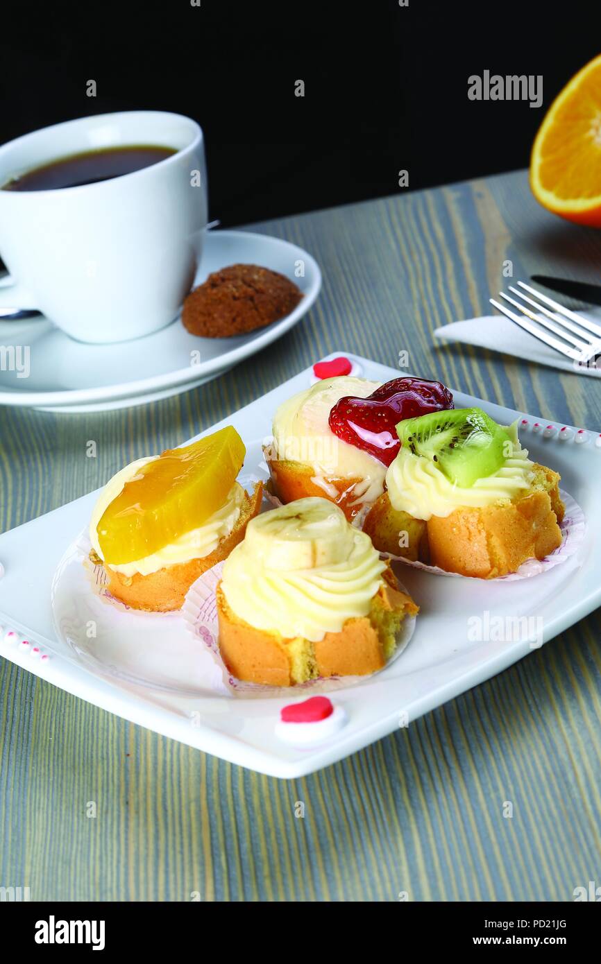 Fruit Eclairs, Assorted Tarts Stock Photo - Alamy