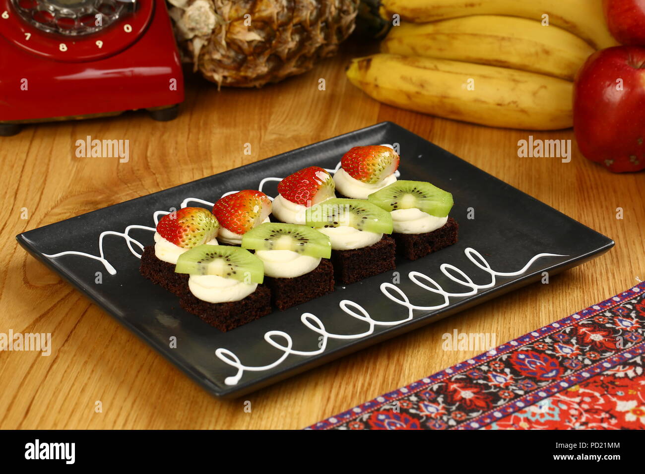Fruit Eclairs, Assorted Tarts Stock Photo - Alamy