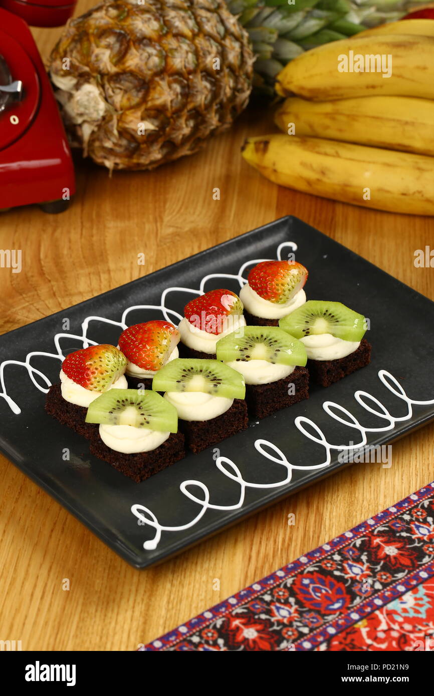 Fruit Eclairs, Assorted Tarts Stock Photo - Alamy