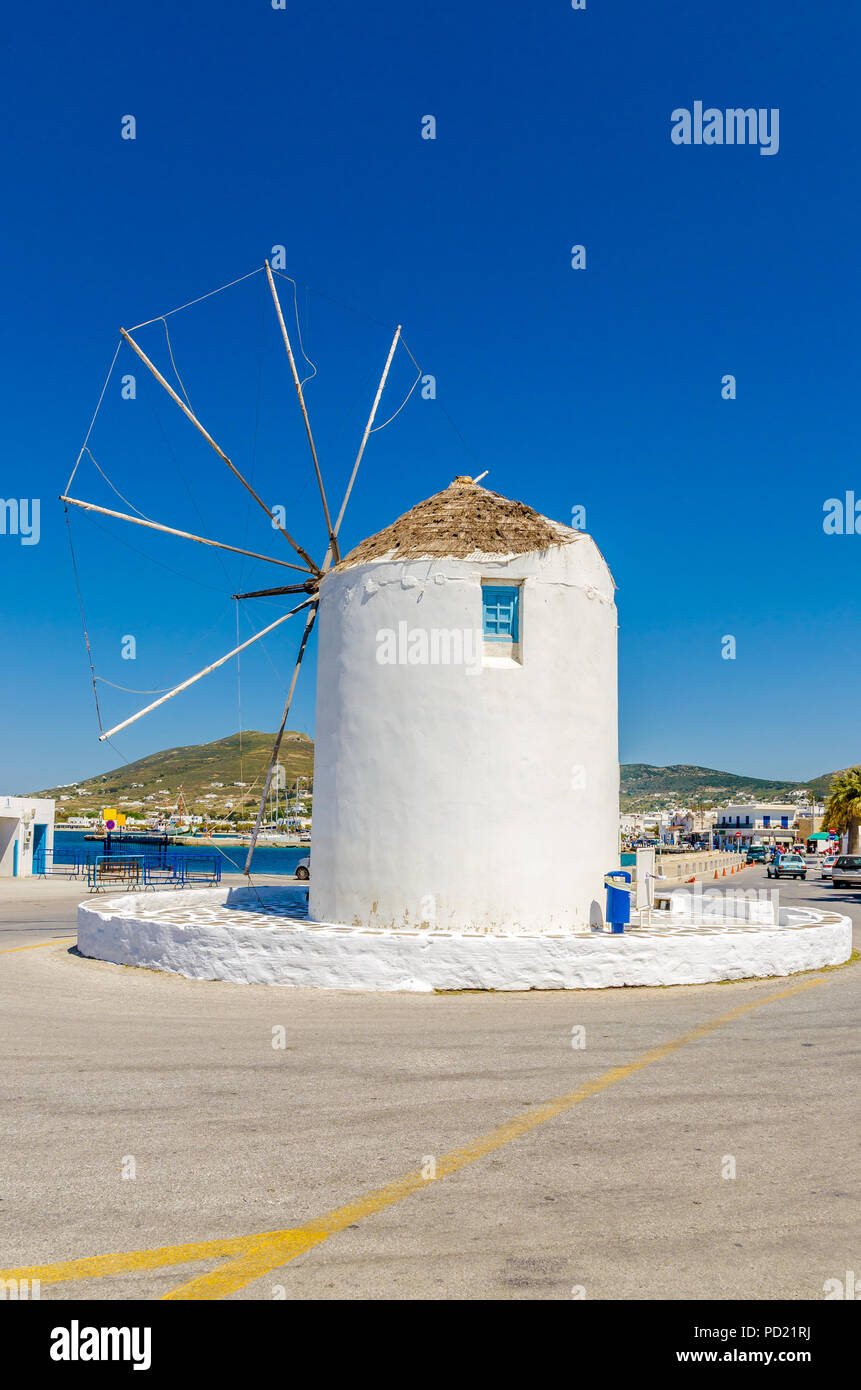 Whitewashed traditional windmill overlooking Parikia port, Paros island ...