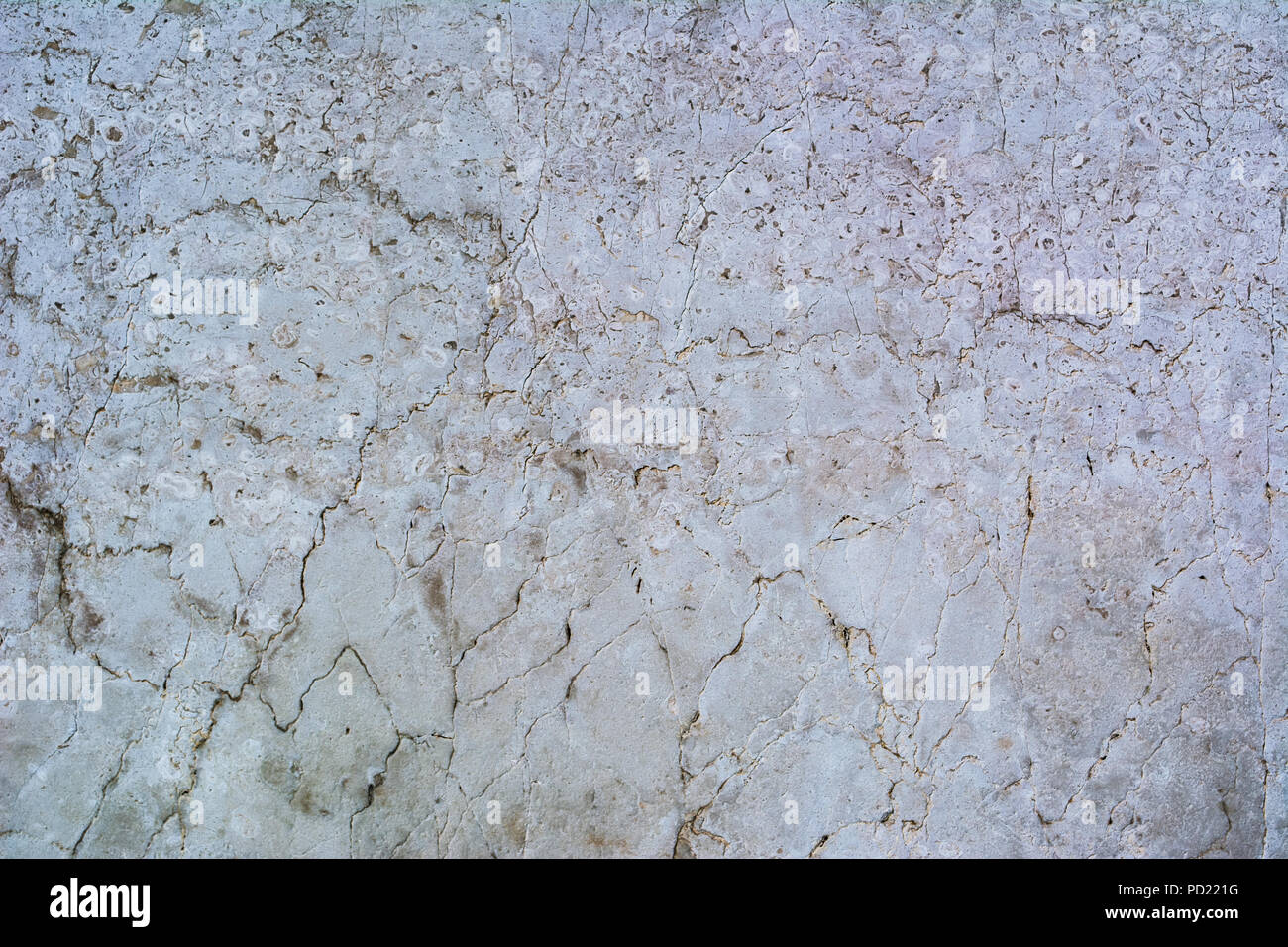 Ancient white stone wall with dark streakes Stock Photo - Alamy