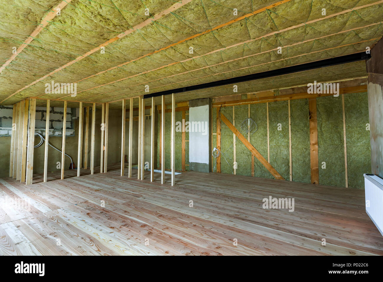 Construction and renovation of big spacious empty unfinished attic room ...