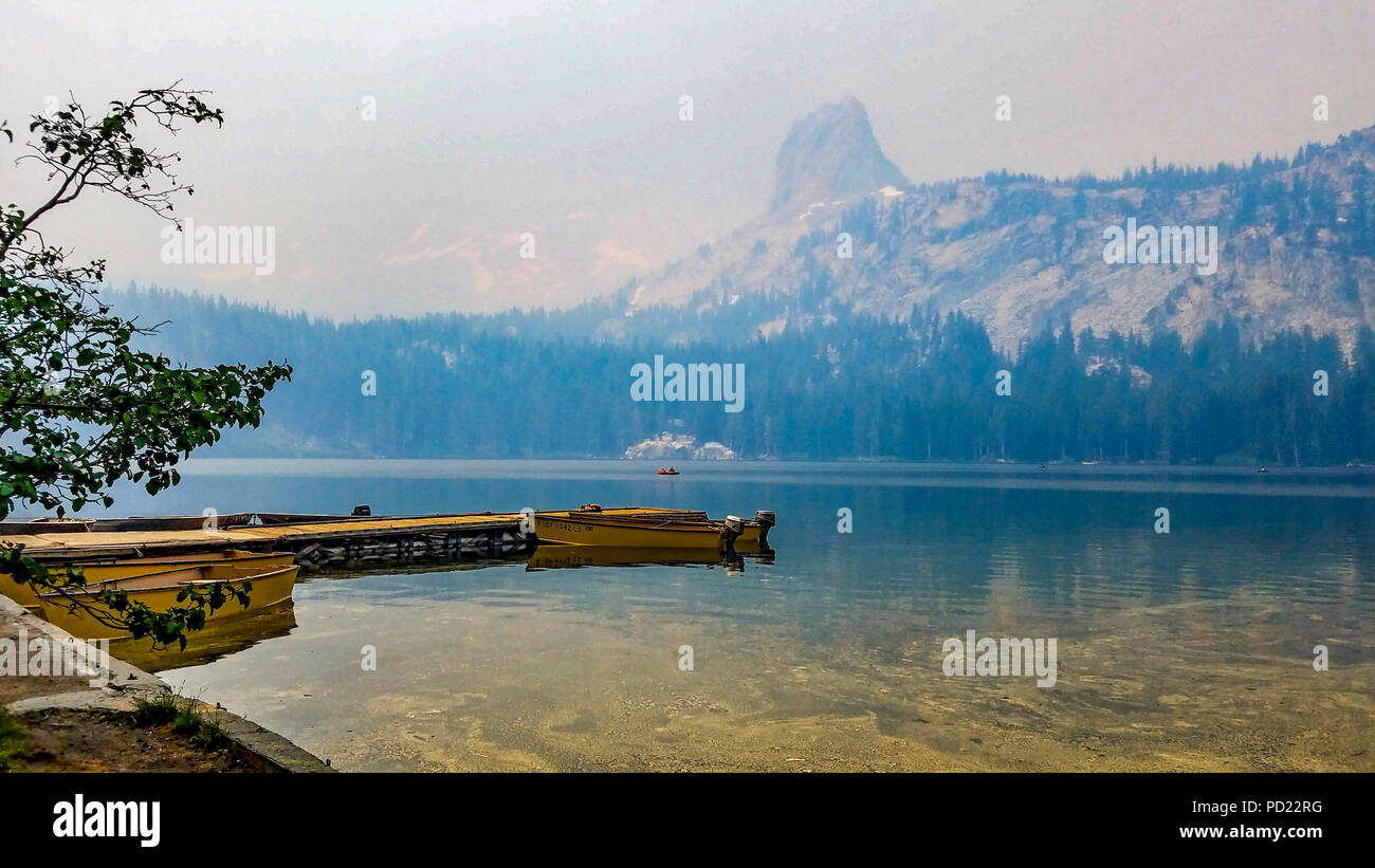 Boat pier at Lake George with Crystal Crag in the background and ...